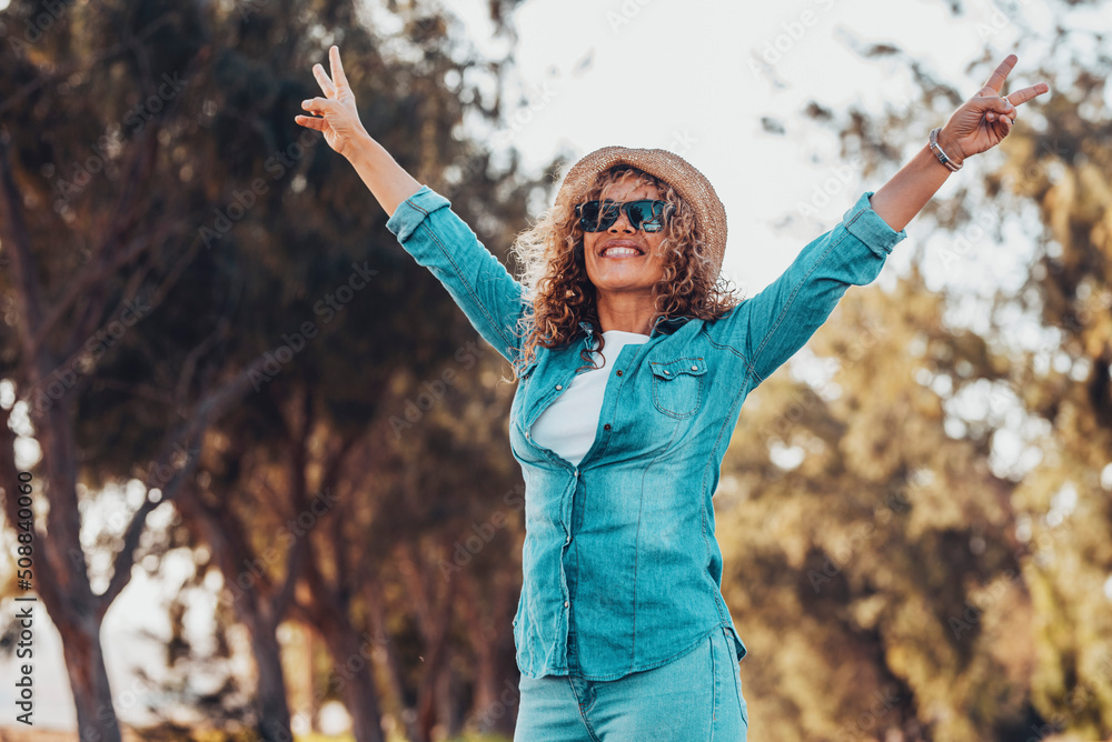 Overjoyed people happy woman raising her arms with victory gesture and ...