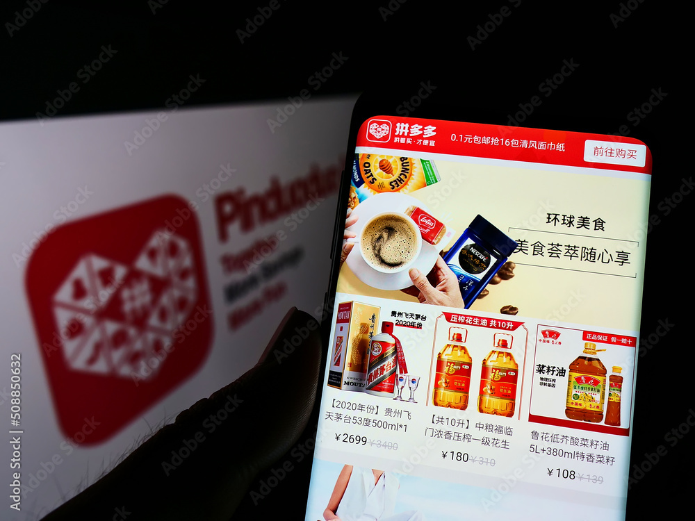 Stuttgart, Germany - 05-22-2022: Person holding smartphone with webpage of Chinese e-commerce ...