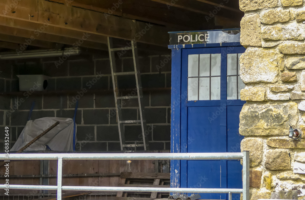 Old unattended blue Police phone box which has landed in an ...