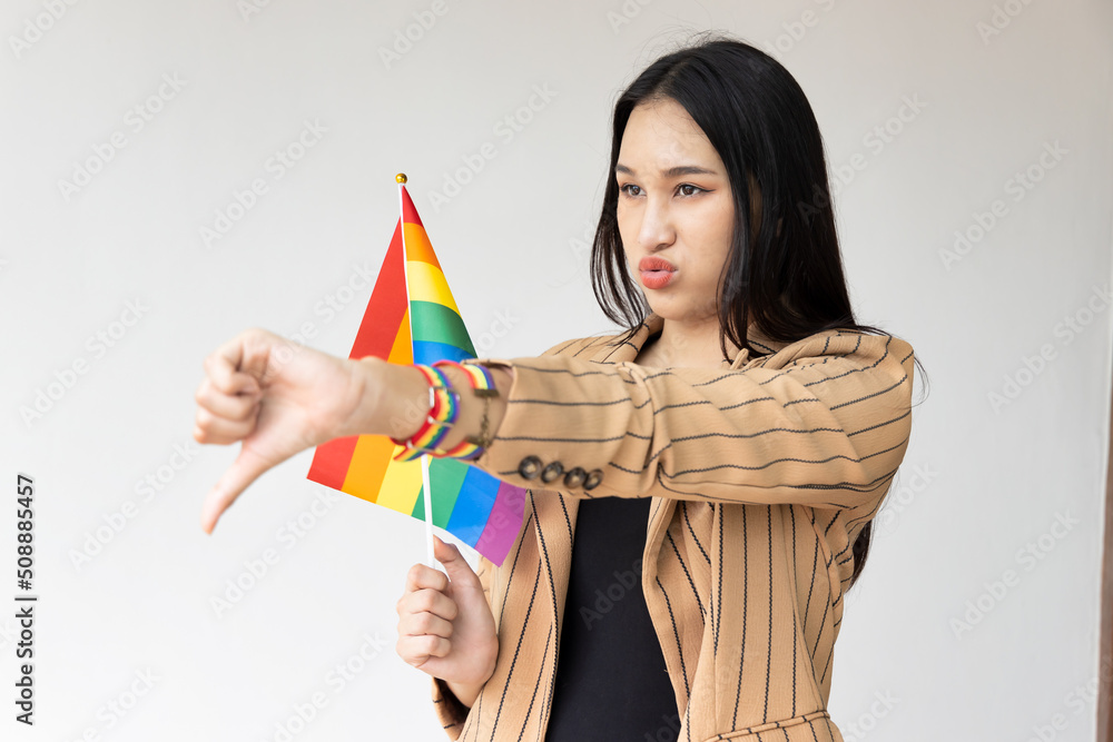 Non-binary LGBT person showing bad rejecting thumb down hand sign ...