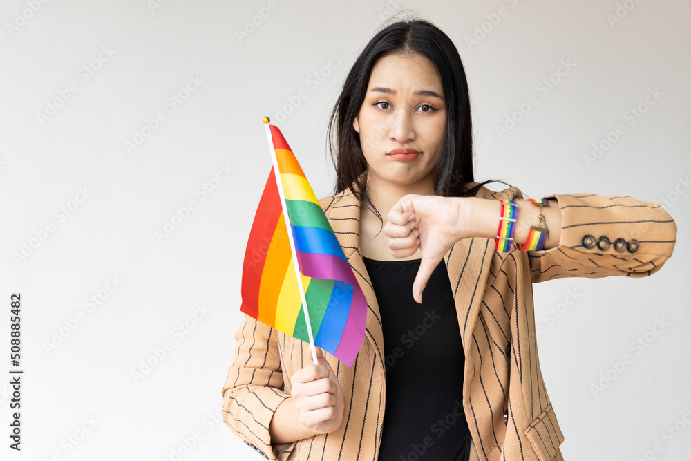 Non-binary LGBT person showing bad rejecting thumb down hand sign ...
