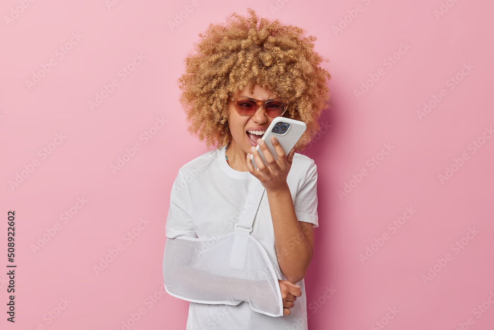 Outraged woman screams angrily and complains at mobile phone reads ...