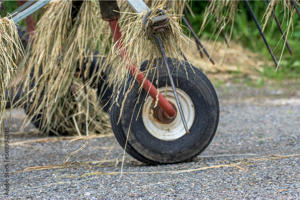 Hay Tedder with some dry grass still hanging from it after working the ...