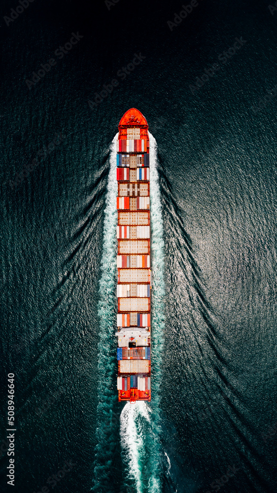container ship sailing fulll speed to transport goods in containers for ...