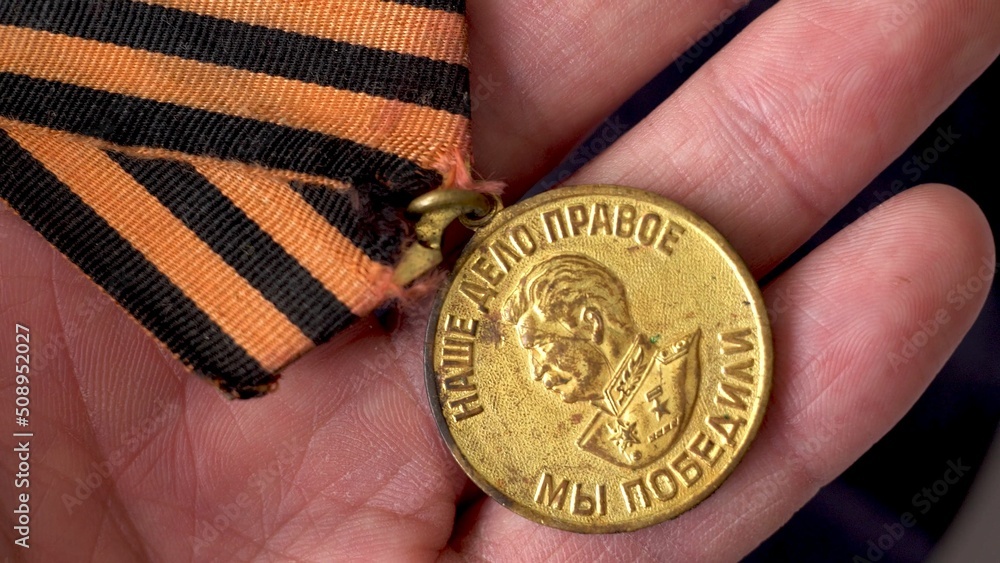Soviet medals in hands. Victory in WWII. The victory of the Russian ...