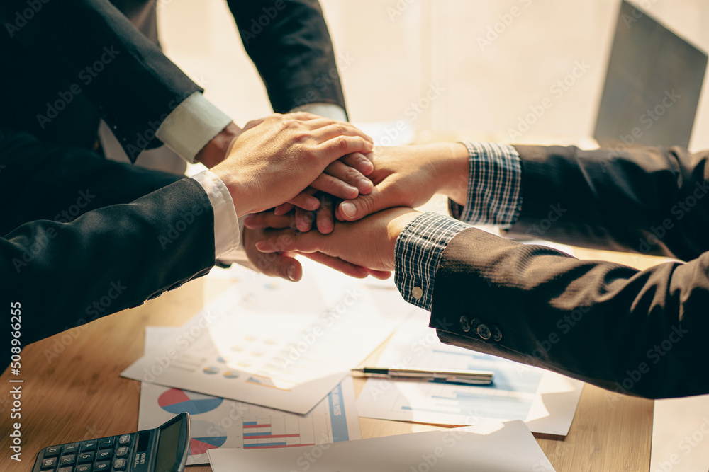 Businesses shake hands and business people join hands to make a ...