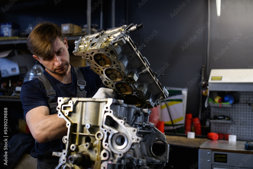 Repairman working with damaged car engine in auto service Stock Photo ...