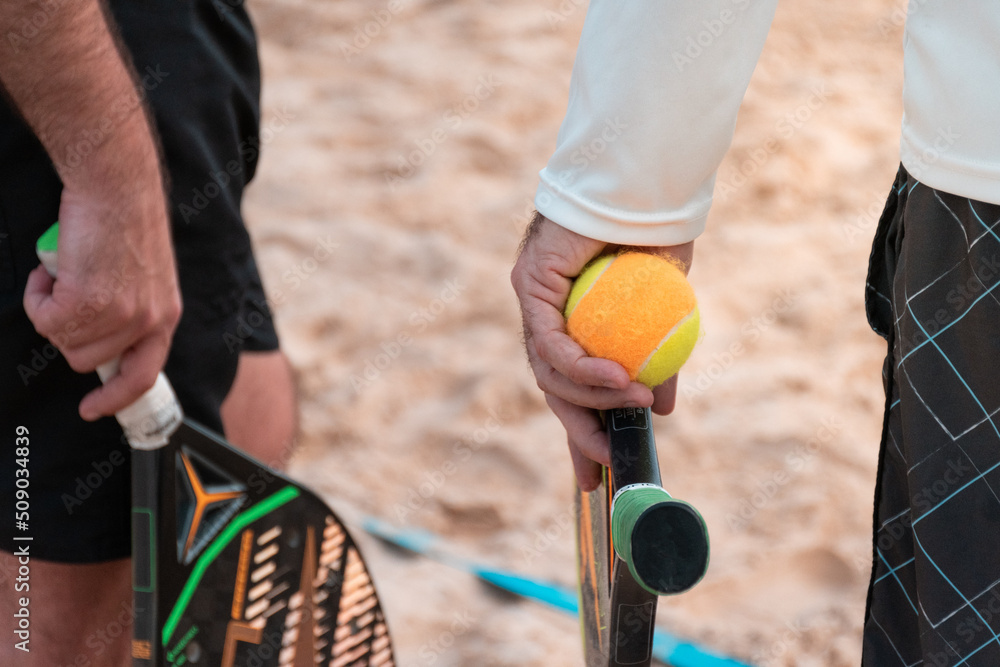 Beach tennis rackets and balls on the beach sand Stock Photo | Adobe Stock