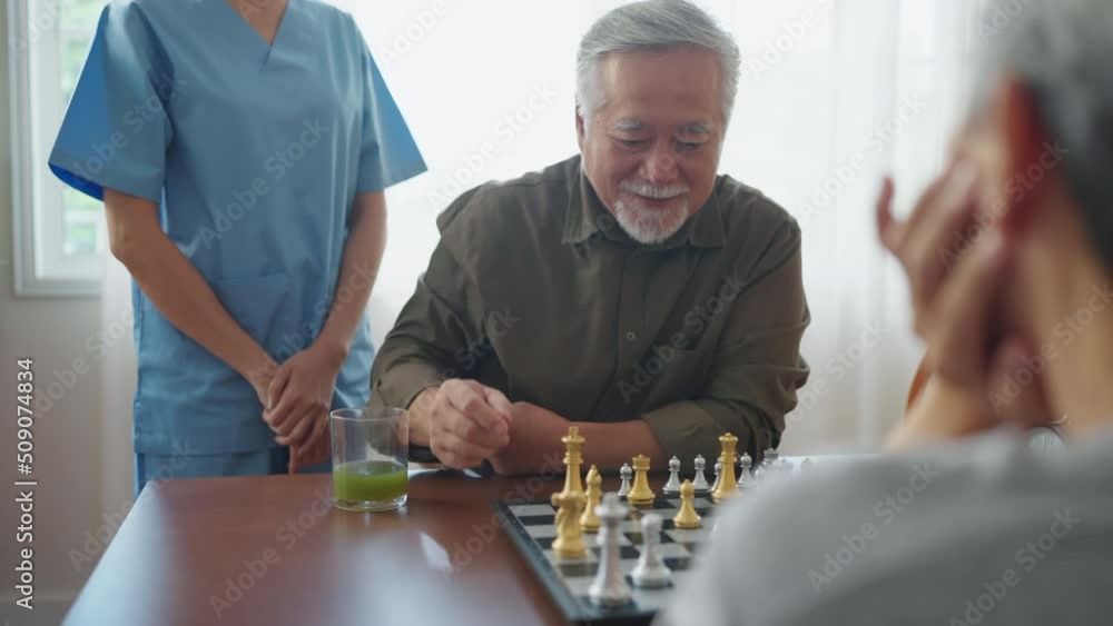 chess board game with fun and exited old senior male friend playing ...