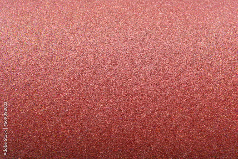 Sandpaper texture background where you can see the red-brown sand grain ...