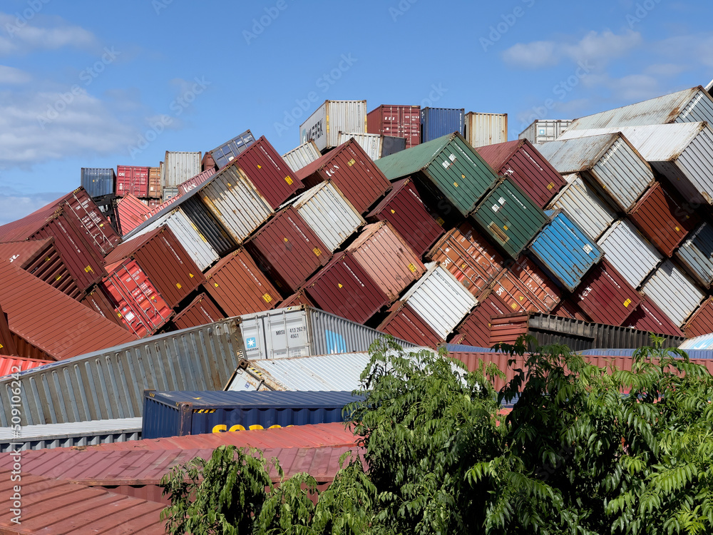 Hundreds of stacked shipping containers collapsed when heavy storms ...