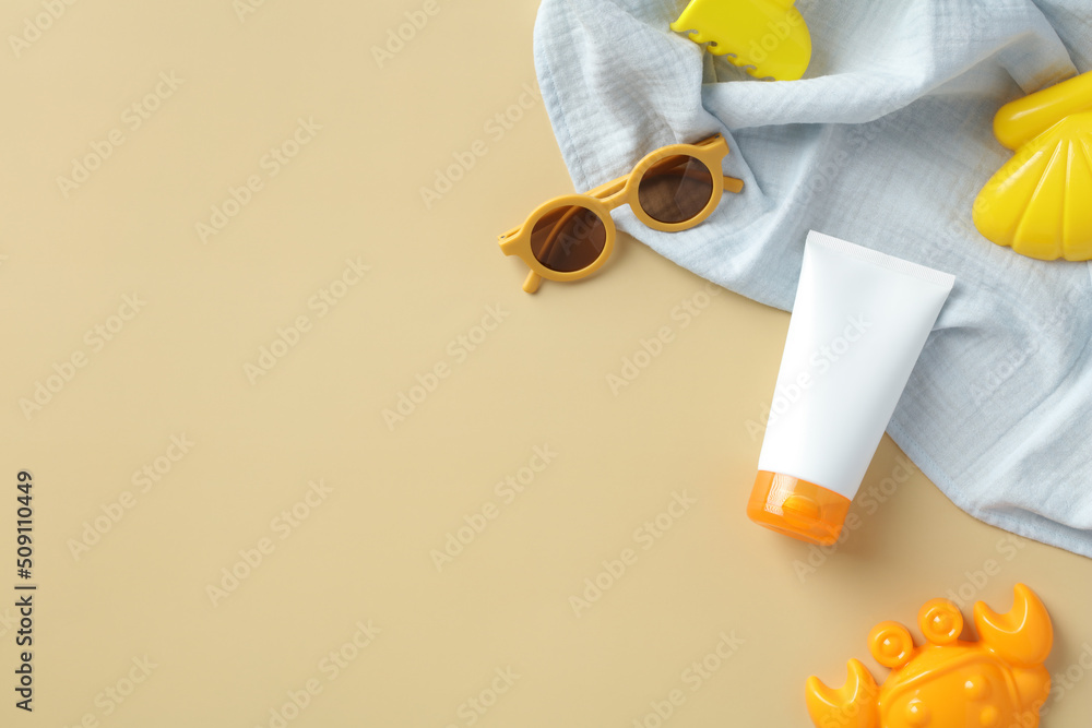 Sunscreen tube mockup, child sunglasses, sand molds on beige background ...