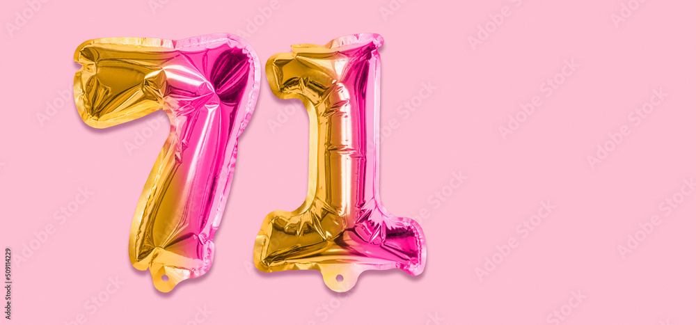 Rainbow foil balloon number, digit seventy one on a pink background ...
