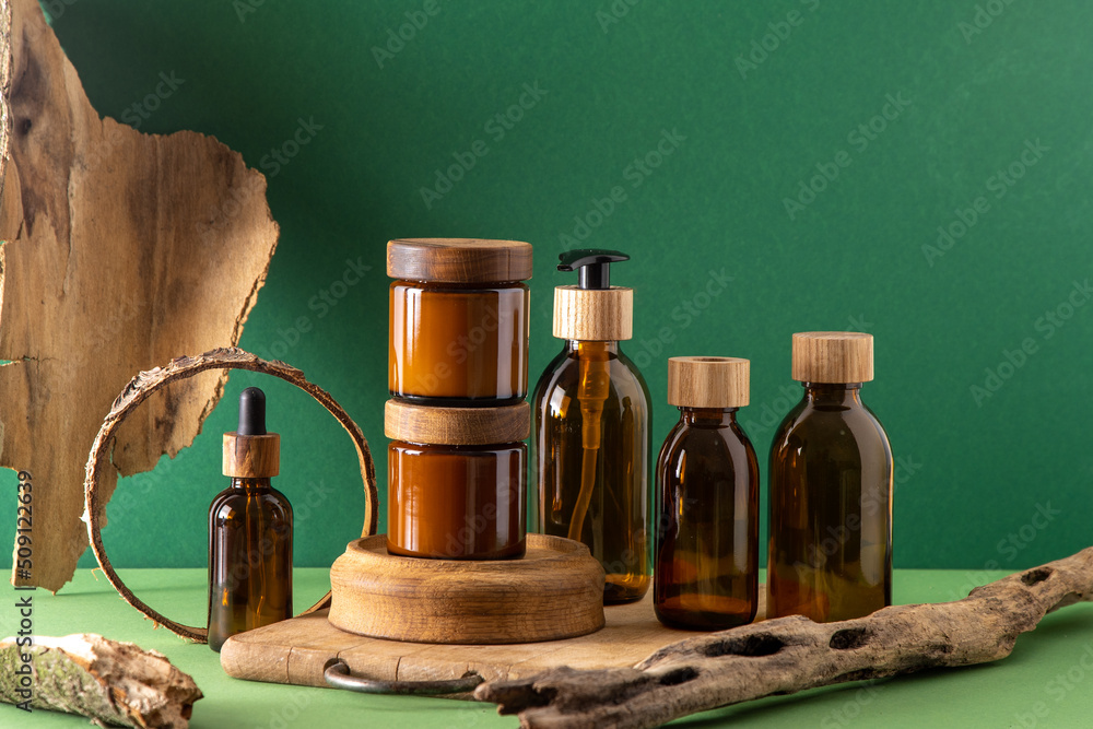 Glass brown containers for cosmetics with wooden lids. Cream jar ...