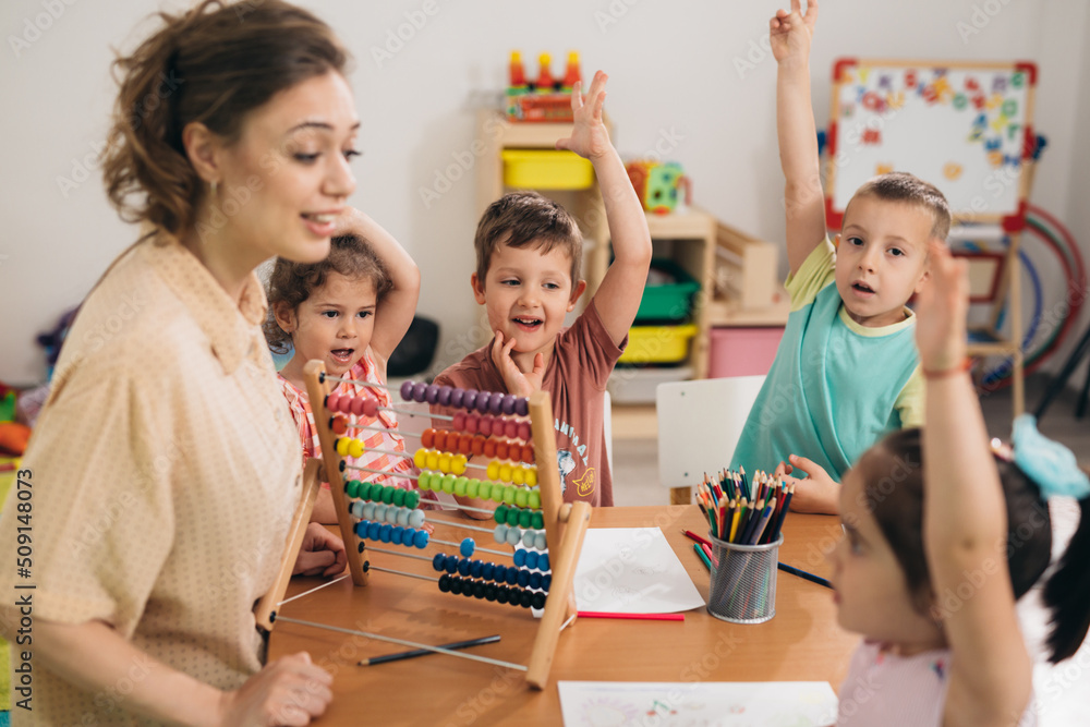 teacher and kids teaching to calculate on abacus in classroom Stock ...