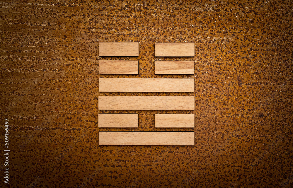 wooden Gene Key 55 i ging hexagram on rusty metal background human ...