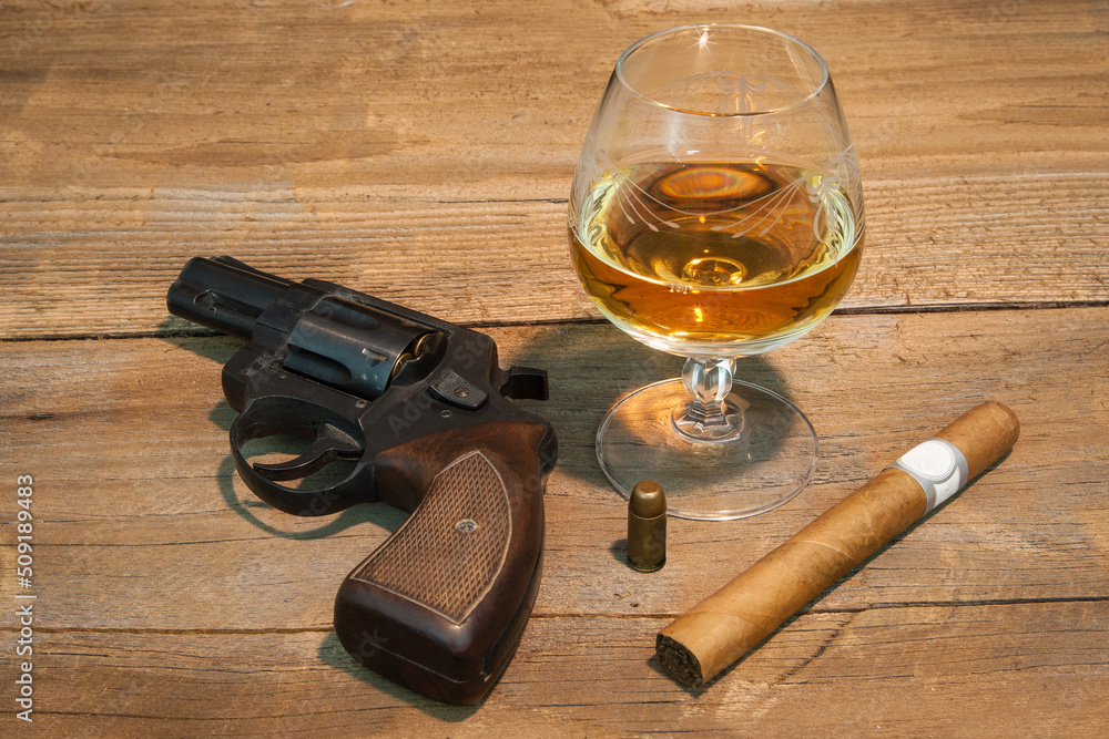 Symbols of Mafia Power. Revolver, cognac, cigar and a projectile ...
