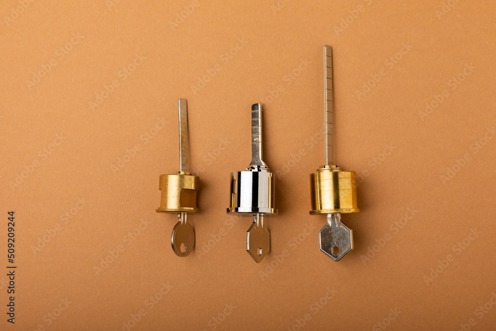 New door lock on a brown background. Patent and keys from the front ...