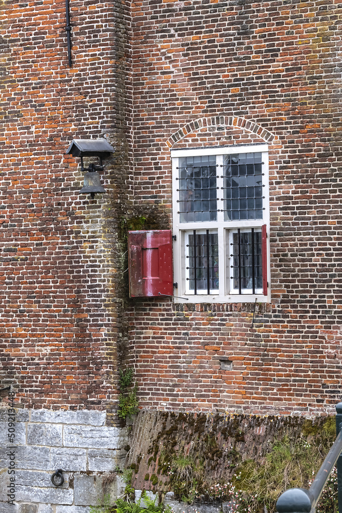 Picturesque medieval fortress city wall gate Koppelpoort and Eem River ...