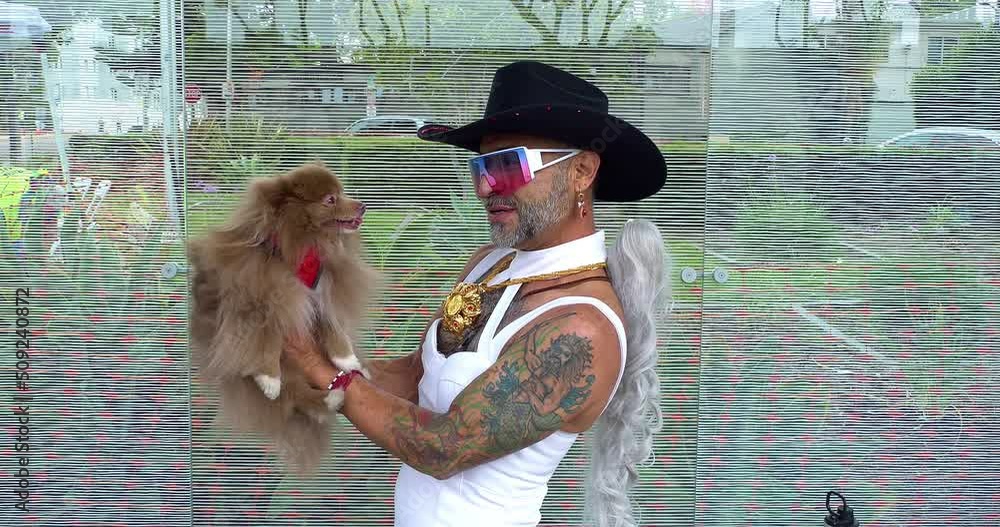 Vídeo do Stock: A gay man playing and talking to friendly dog during ...