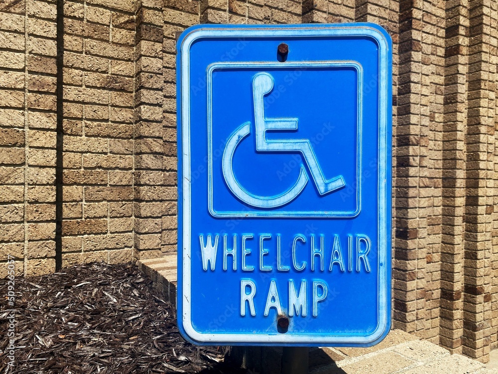 Foto de Sign wheelchair ramp. Blue square handicap sign with wheelchair ...