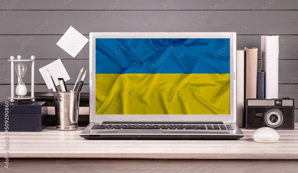 Support Ukraine, donate help Ukrainian people. flag on computer laptop ...