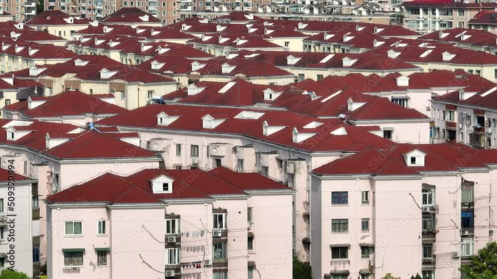 Drone aerial view of Crowded residential buildings with red roof. The ...