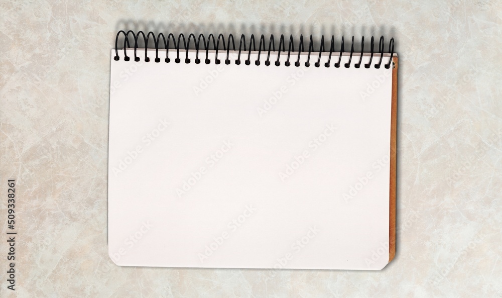 Classic notepad or calendar on workplace background. Stock Photo ...