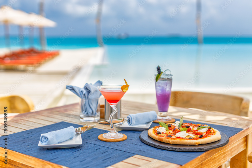Luxury resort hotel poolside, outdoor restaurant on the beach, ocean ...