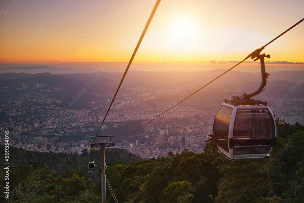 Modular cabins cable car against the bright sky, clouds ans mountains ...