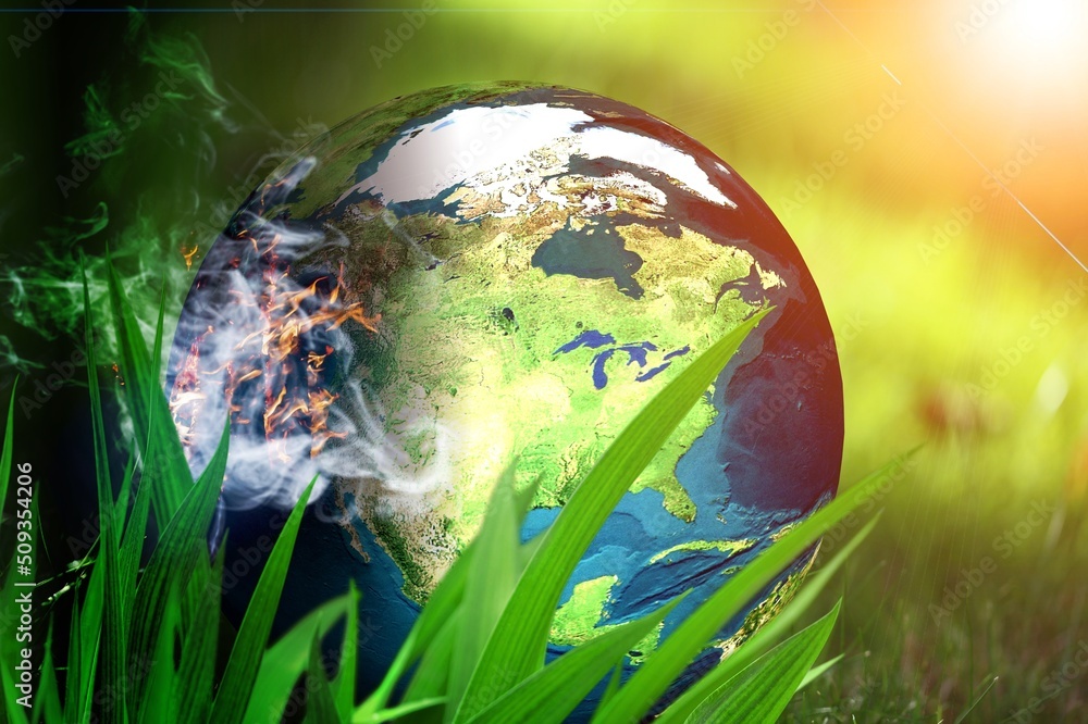 Earth planet globe with smoke on grass. Bad climate concept ...