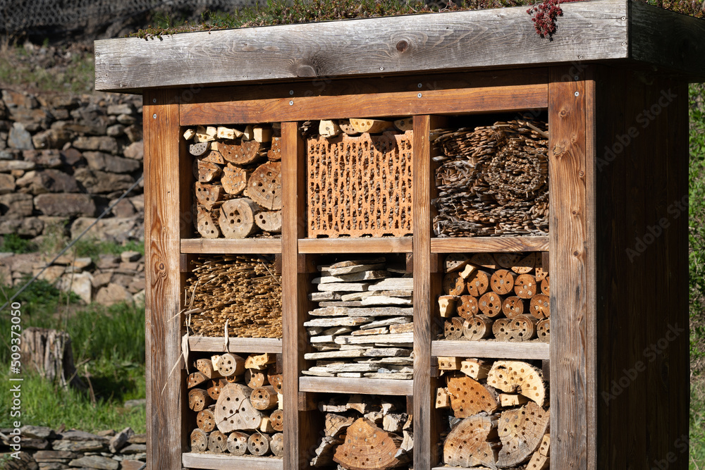 Large insect hotel providing habitat for cavity nesting bees, wasps and ...