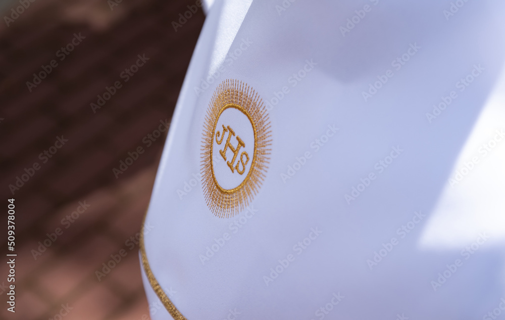 IHS Christian symbol on a communion child. IHS Christogram embroidered ...