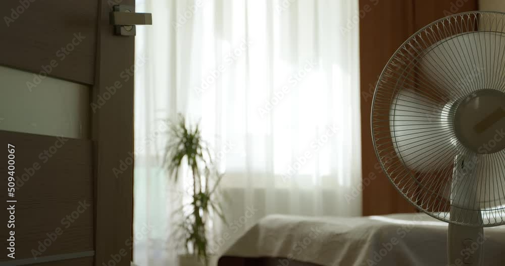 An electronic fan cools the room on a hot summer day. Stock Video ...