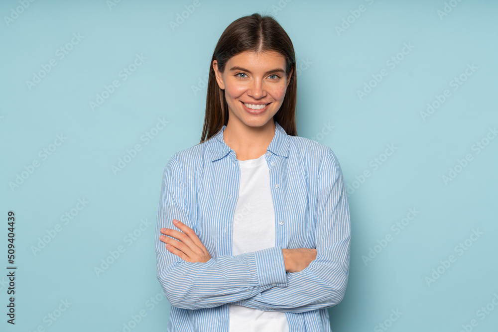 Positive confident businesswoman standing against studio background ...