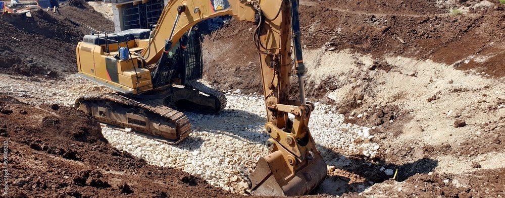 soil movement , digging a pit, excavation , road works , road ...