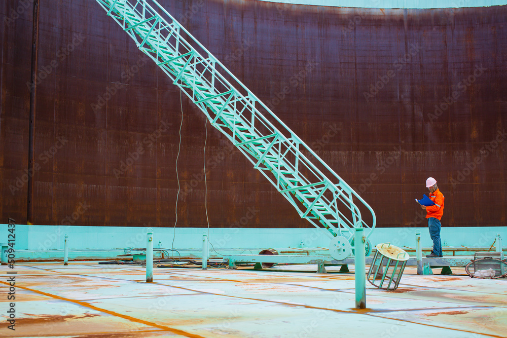 Male worker inspection visual roof rolling ladder storage tank Stock ...