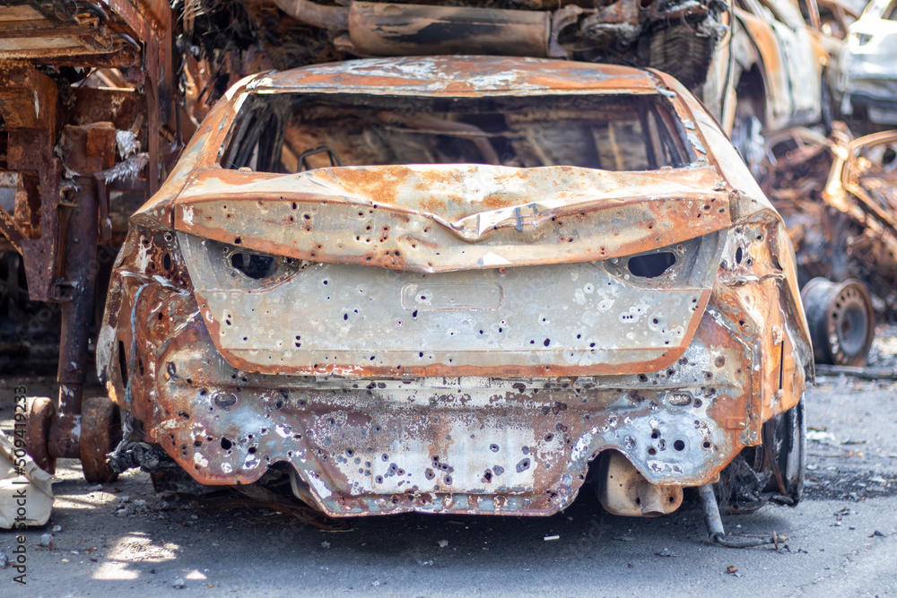 Russian invasion of Ukraine in 2022, destroyed and burned cars. Cars ...