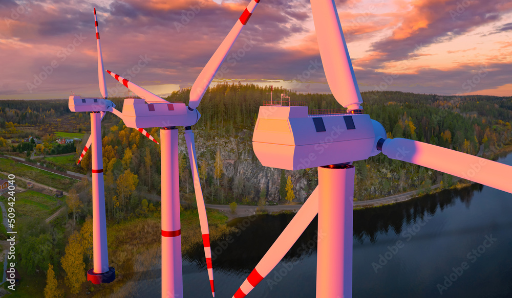 Foto de Offshore power plant. Windmills rise above lake. Giant wind ...