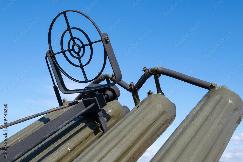 The gun sight and barrels of a old anti-aircraft gun are looking on the ...