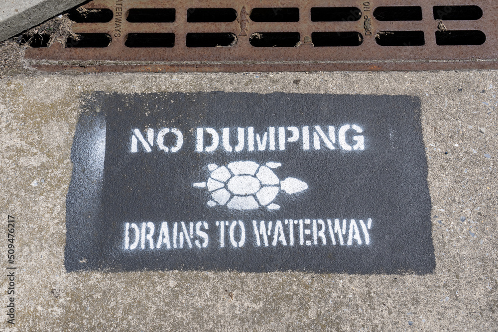 No Dumping Drians to Waterway with turtle spray painted on paving by ...
