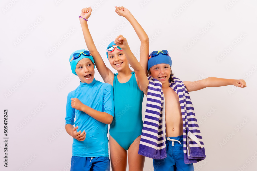 Portrait of brothers dressed in swimsuits for swimming lessons in the ...