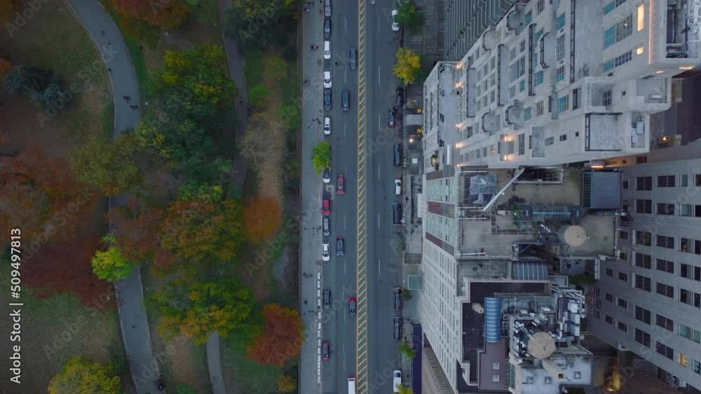 Aerial birds eye overhead top down view of vehicles in street leading ...