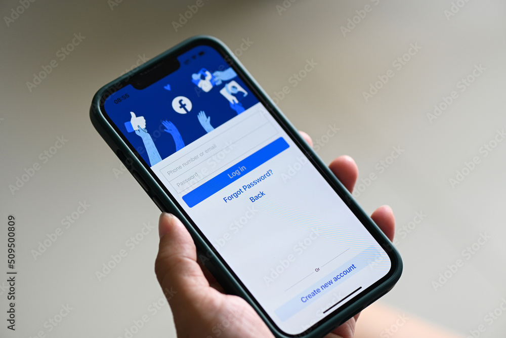 Facebook application icon on Apple iPhone 13 Pro, holding smartphone ...