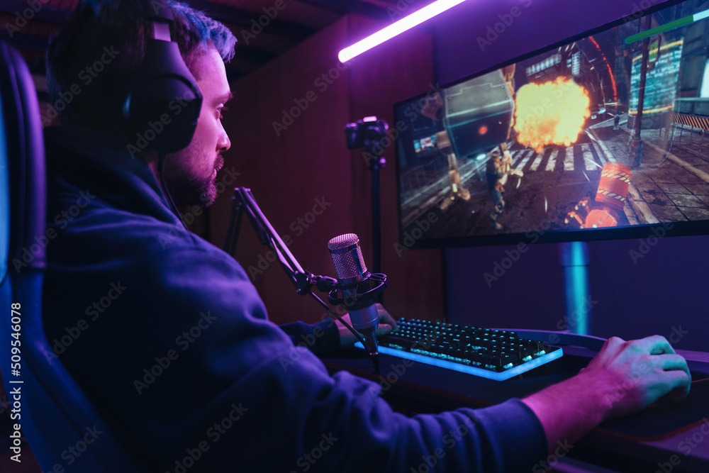 Side view of pro streamer playing video game competition use ...