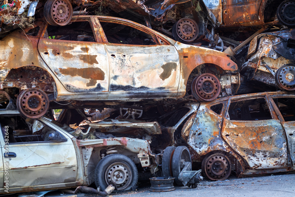 Russian invasion of Ukraine in 2022, destroyed and burned cars. Cars ...