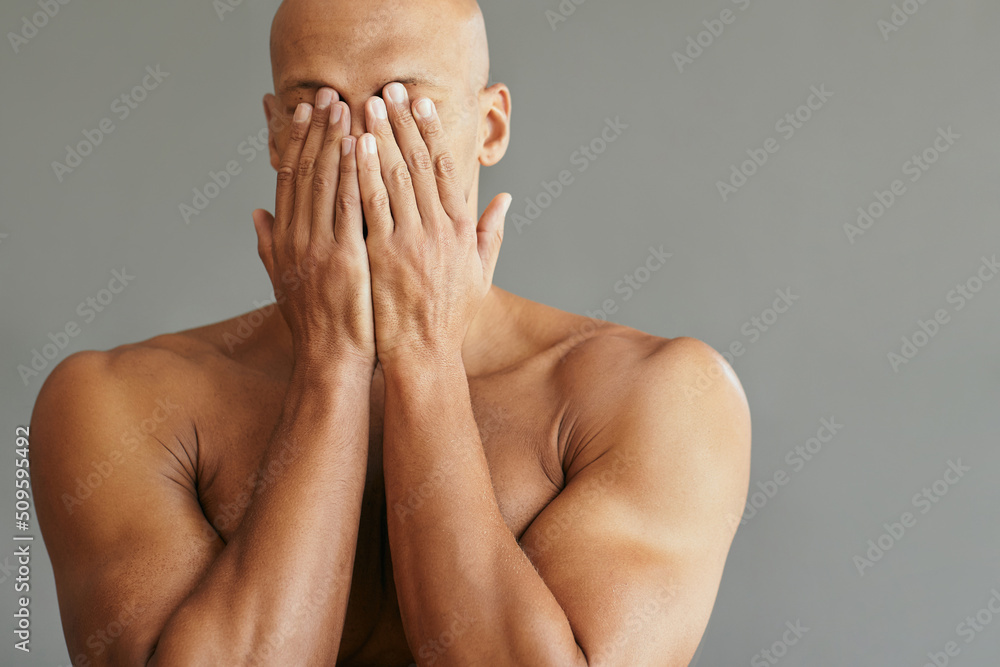 Unrecognizable black man covering his face with hands. Stock Photo ...