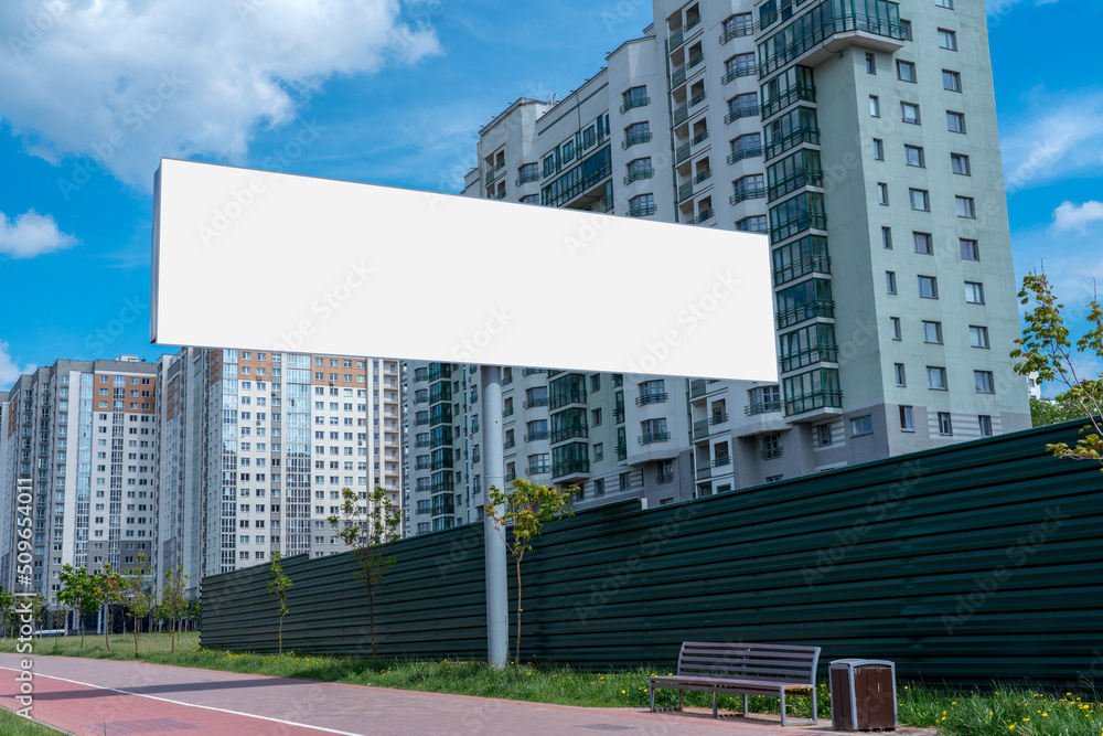 Big empty billboard with mock up place stands at urban sidewalk ...