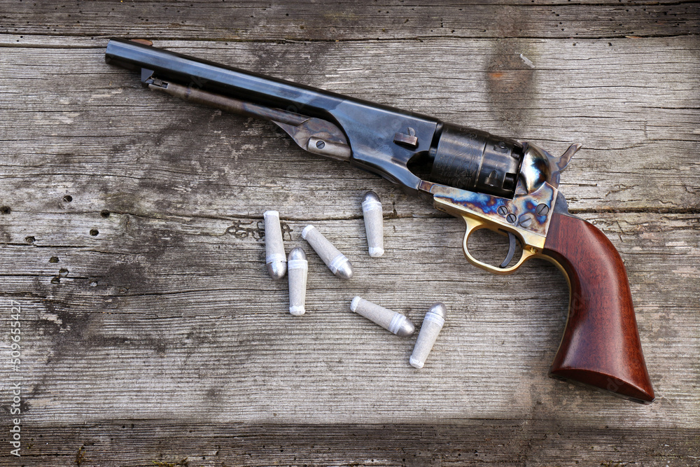Black powder revolver and cartridges on an old board. Stock Photo ...