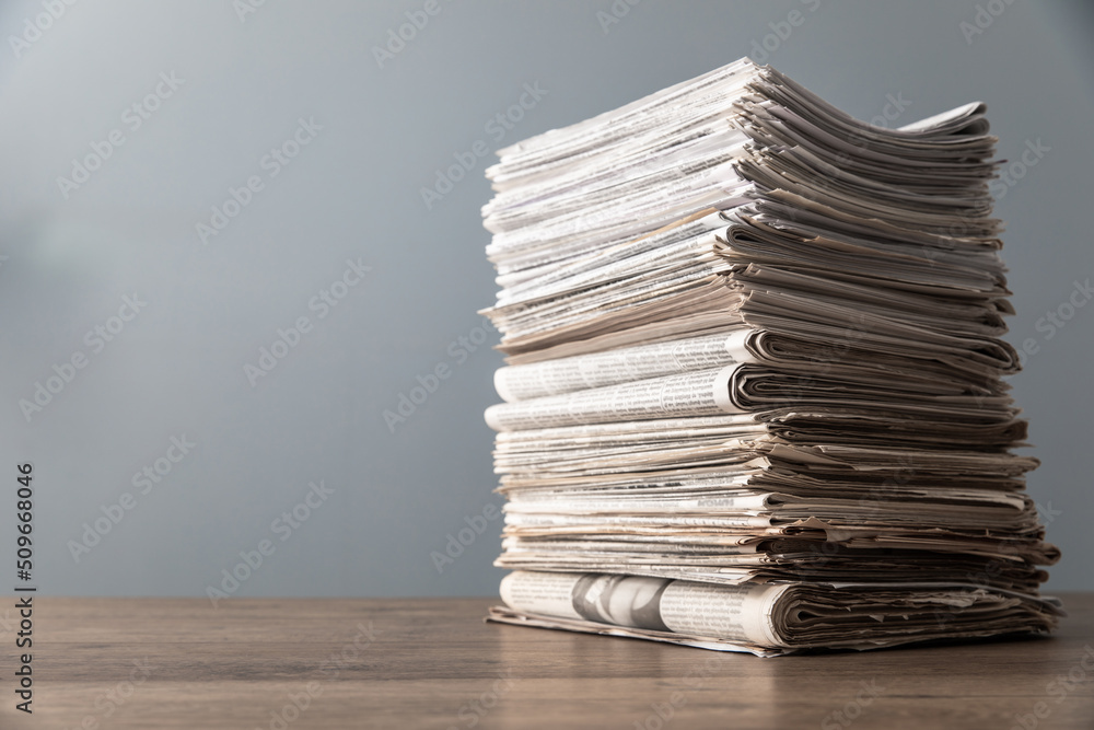 Stack Of Newspapers On Table